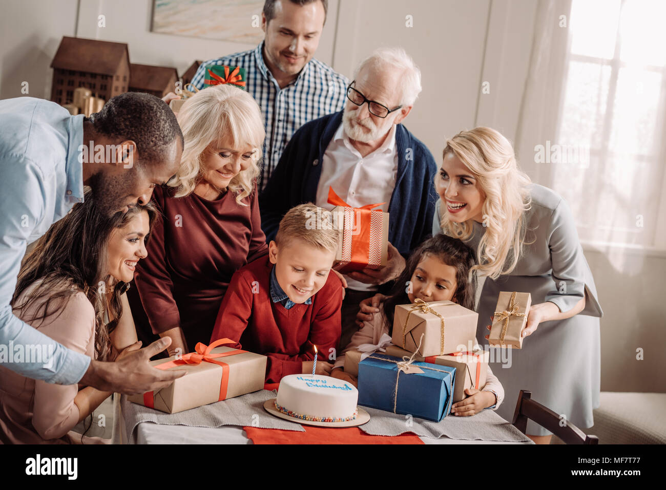 large family celebrating birthday Stock Photo - Alamy