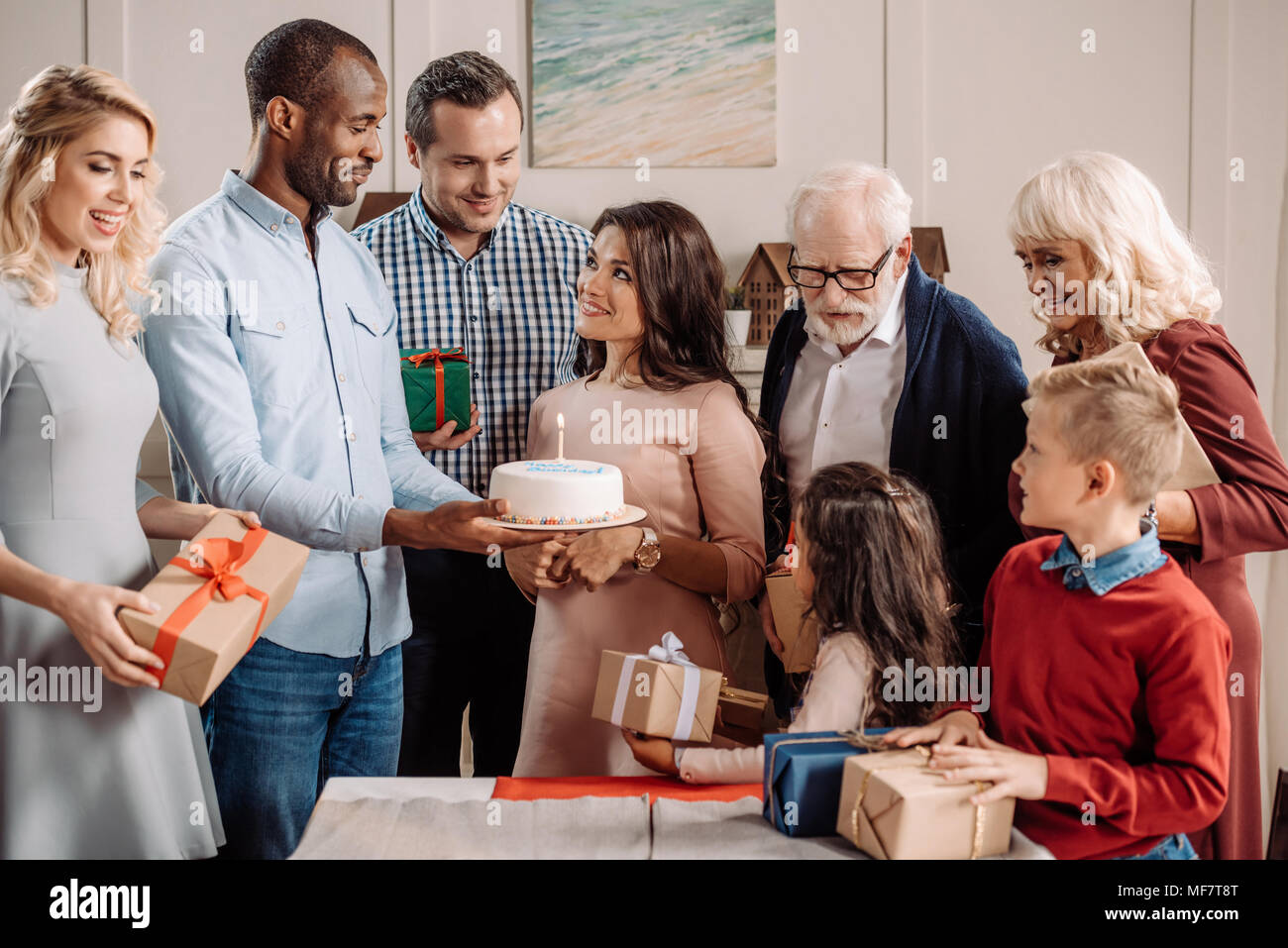 large family celebrating birthday Stock Photo - Alamy