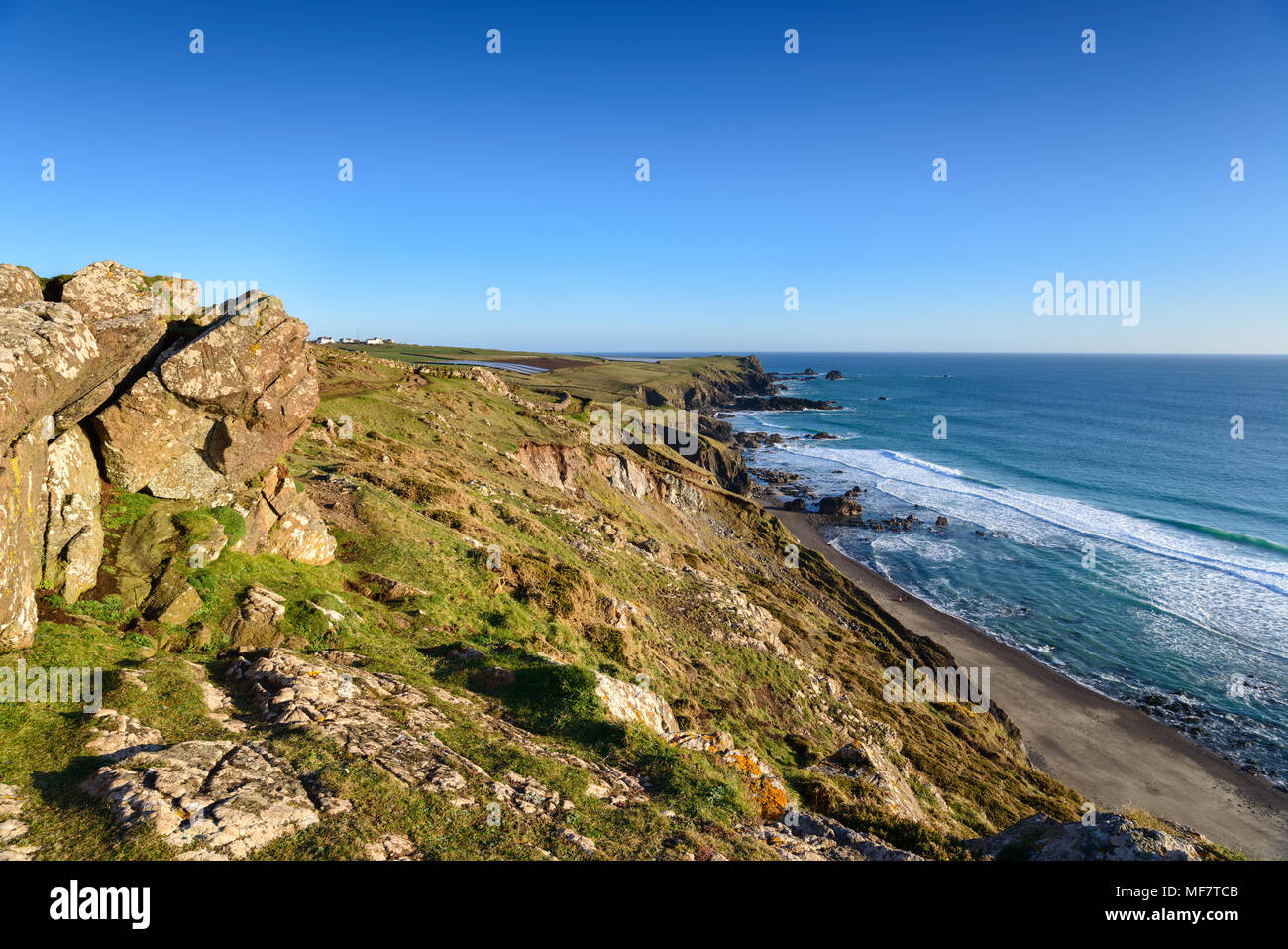 Cliffs on the South West Coast Path overlooking Pentreath Beach to the ...