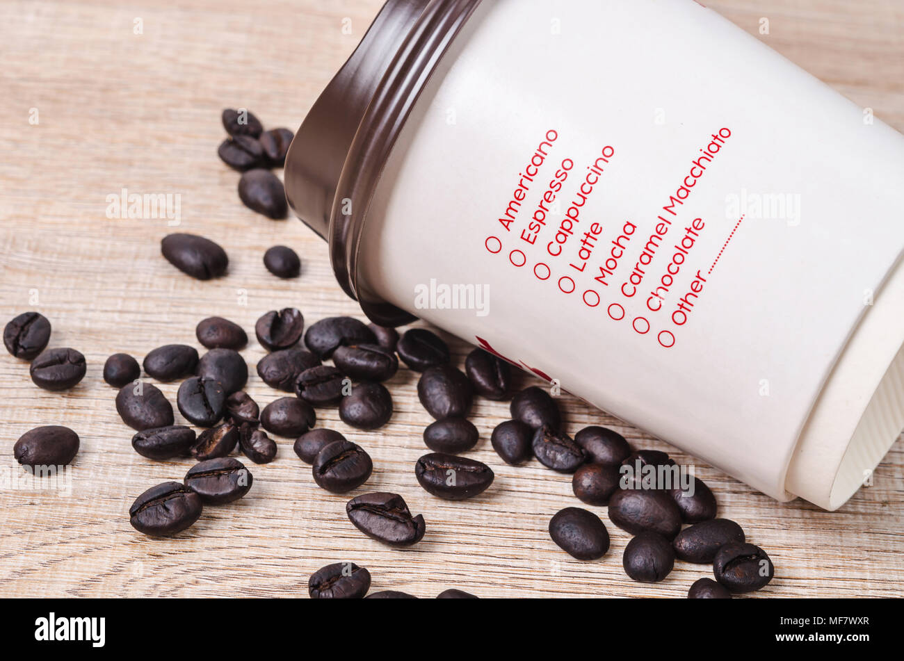 Coffee paper cup with checklist and seeds coffee on table background ...