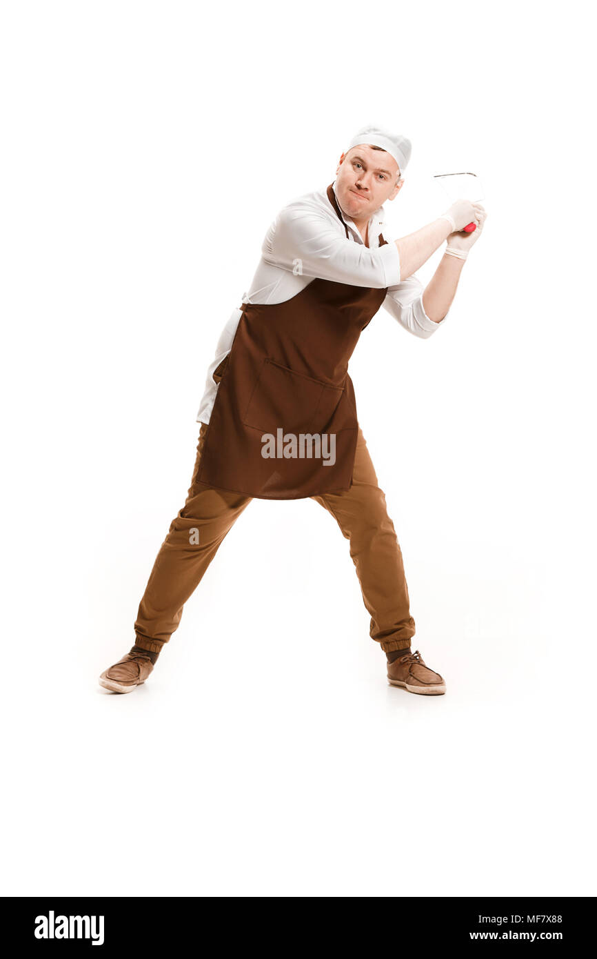 Angry aggressive butcher posing with a cleaver isolated on white ...