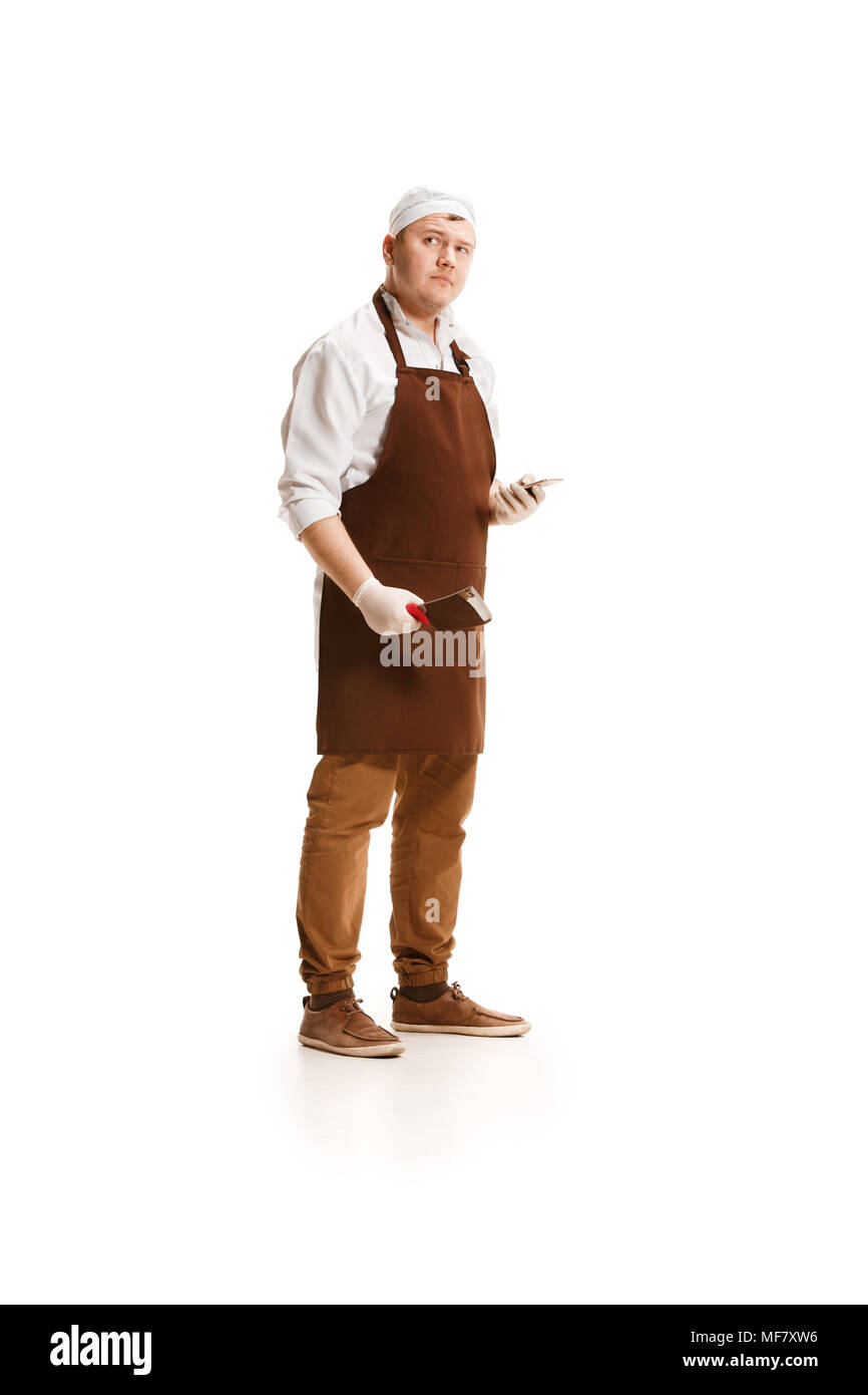 Serious butcher posing with a cleaver isolated on white background ...