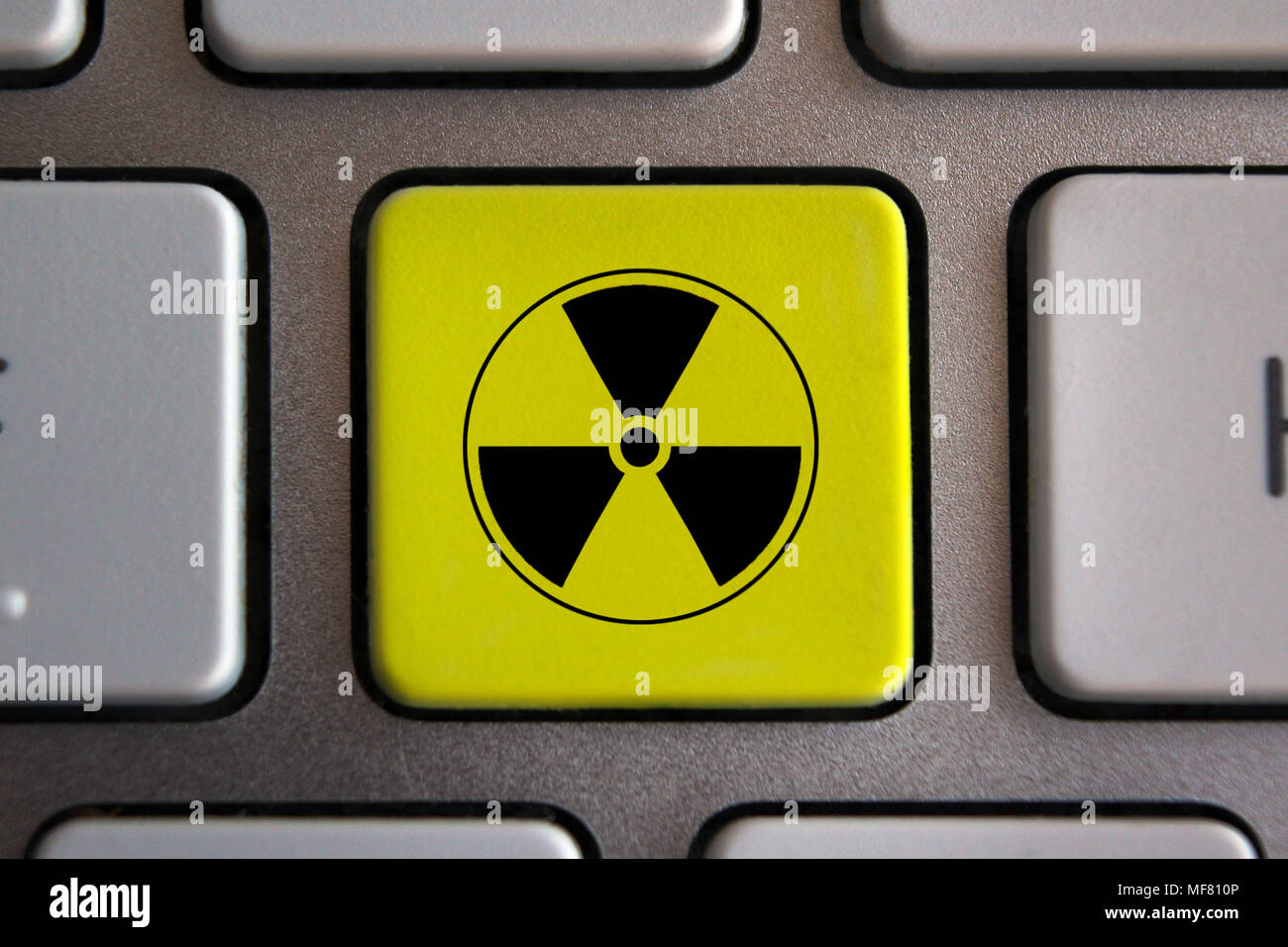 Nuclear radioactive icon printed on keyboard button Stock Photo - Alamy