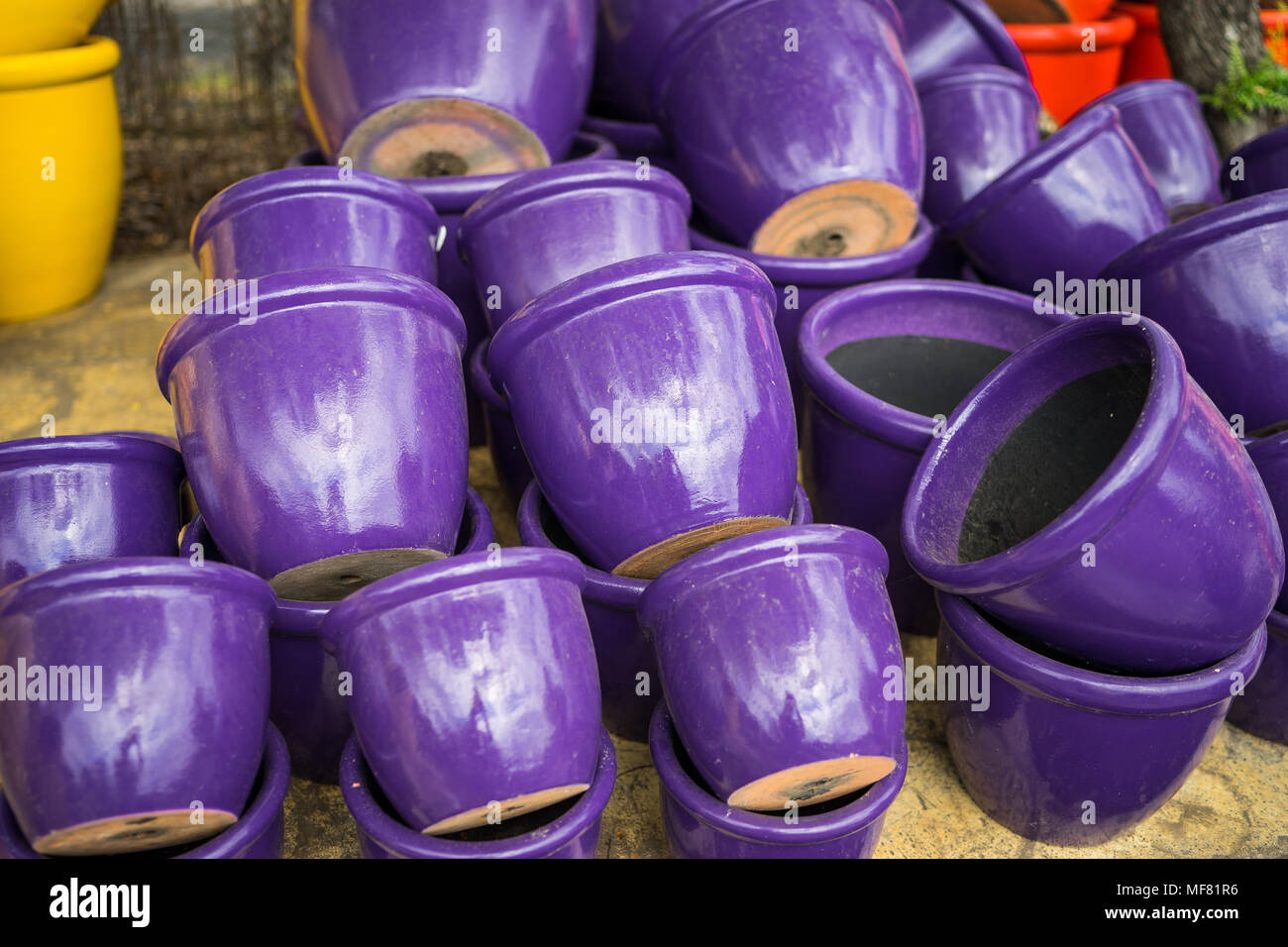 Yellow pots stacked at a plant nursery Stock Photo - Alamy