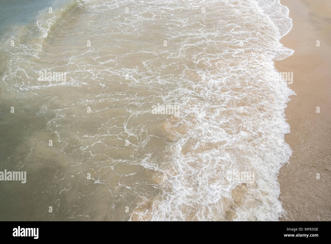 An abstract or concept image of an aerial view of the ocean as it meets ...