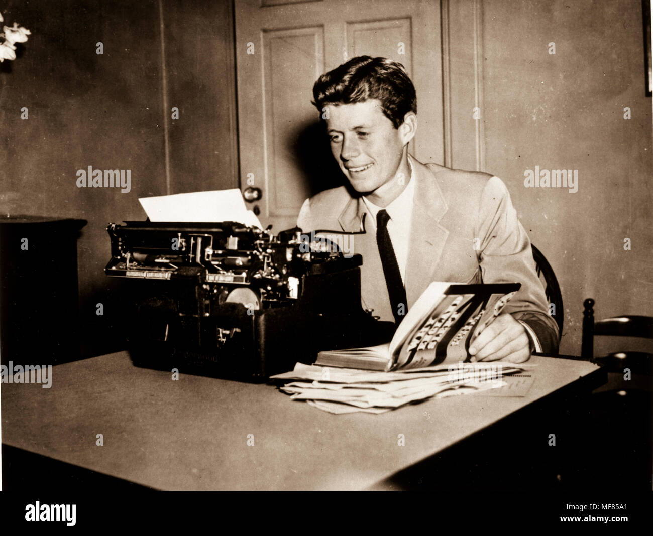 NLK 93-49 P27 ca. 1940 John F. Kennedy at a typewriter with his book ...