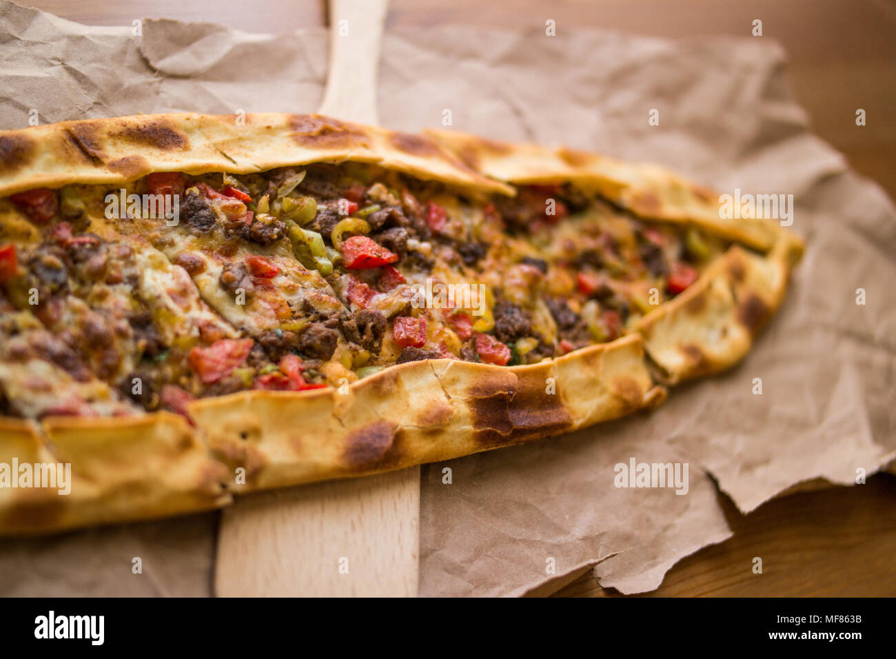 Turkish pide with cheese and cubed meat / kusbasili kasarli pide Stock ...