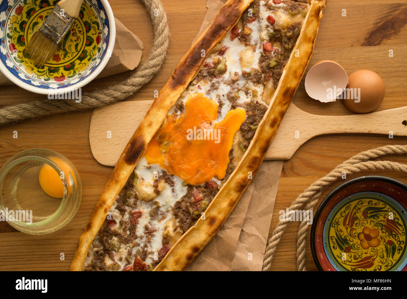 Turkish Pide with egg and minced meat Stock Photo - Alamy
