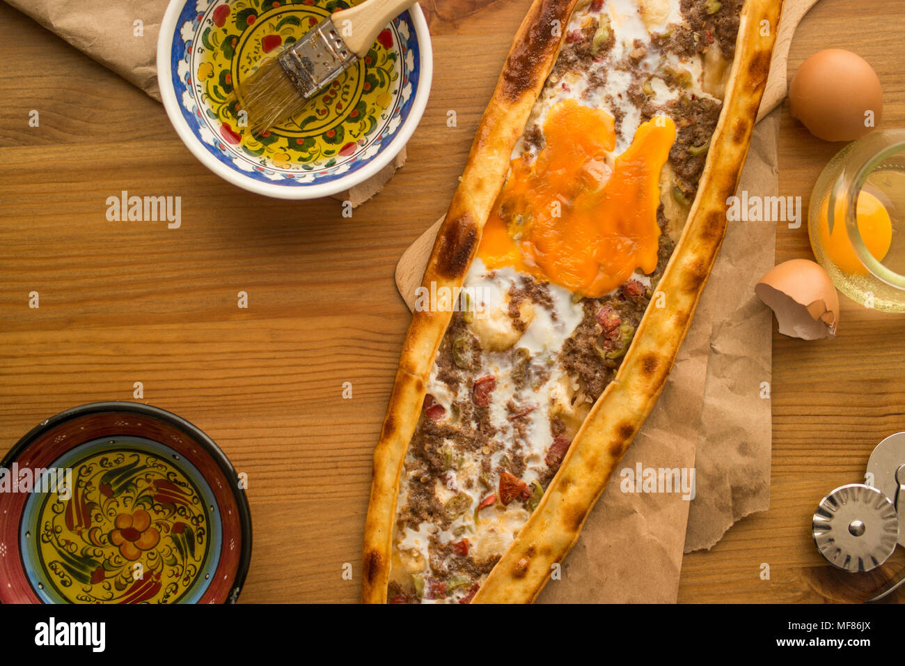 Turkish Pide with egg and minced meat Stock Photo - Alamy