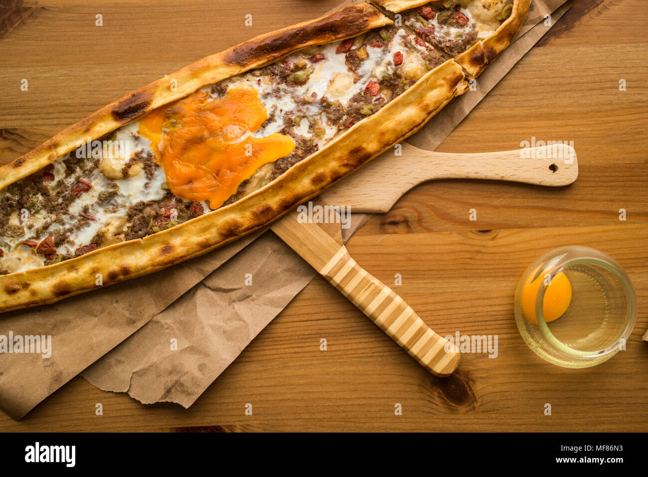 Turkish Pide with egg and minced meat Stock Photo - Alamy