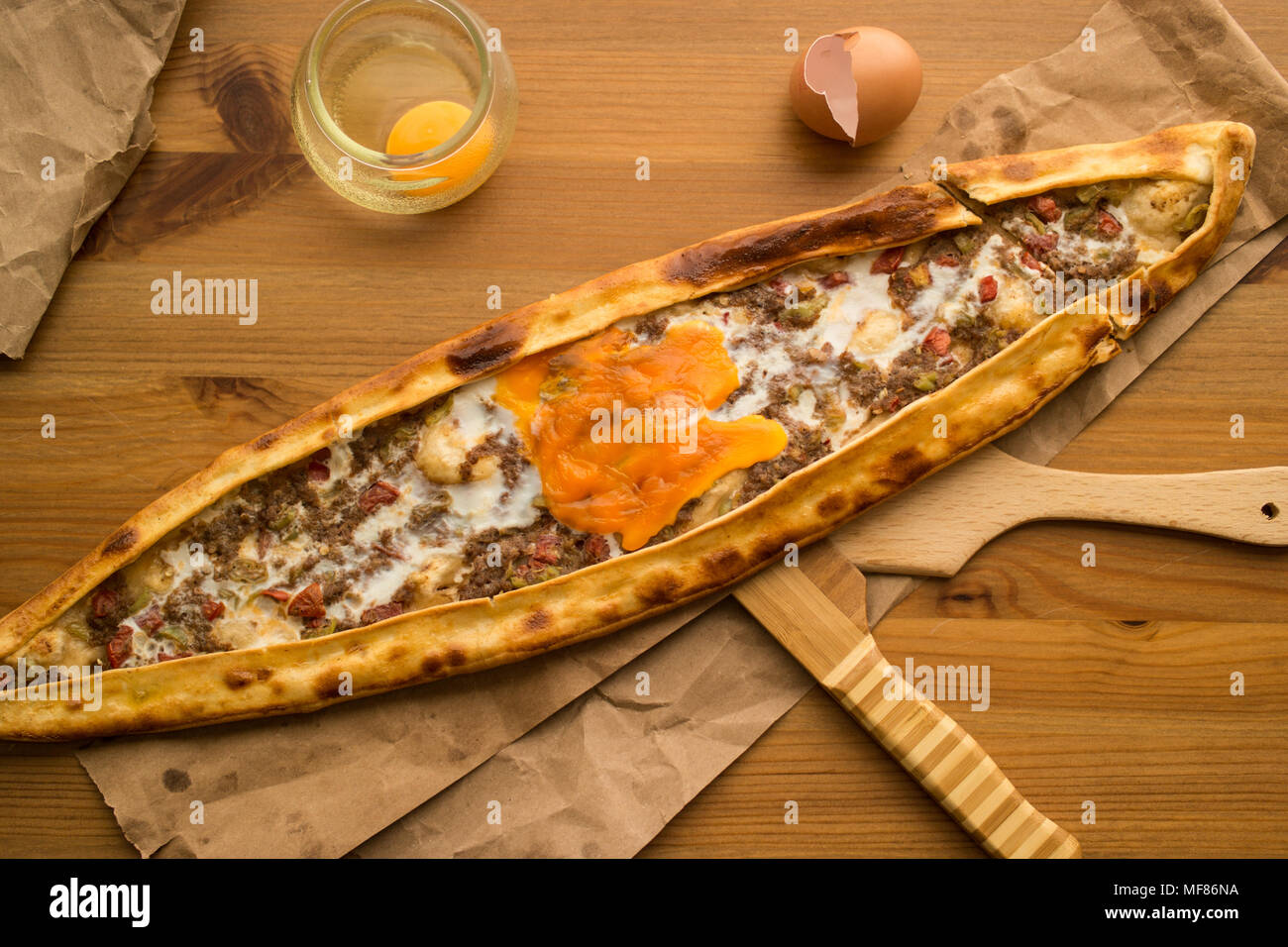 Turkish Pide with egg and minced meat Stock Photo - Alamy