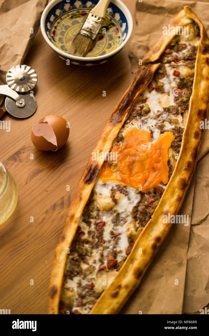 Turkish Pide with egg and minced meat Stock Photo - Alamy