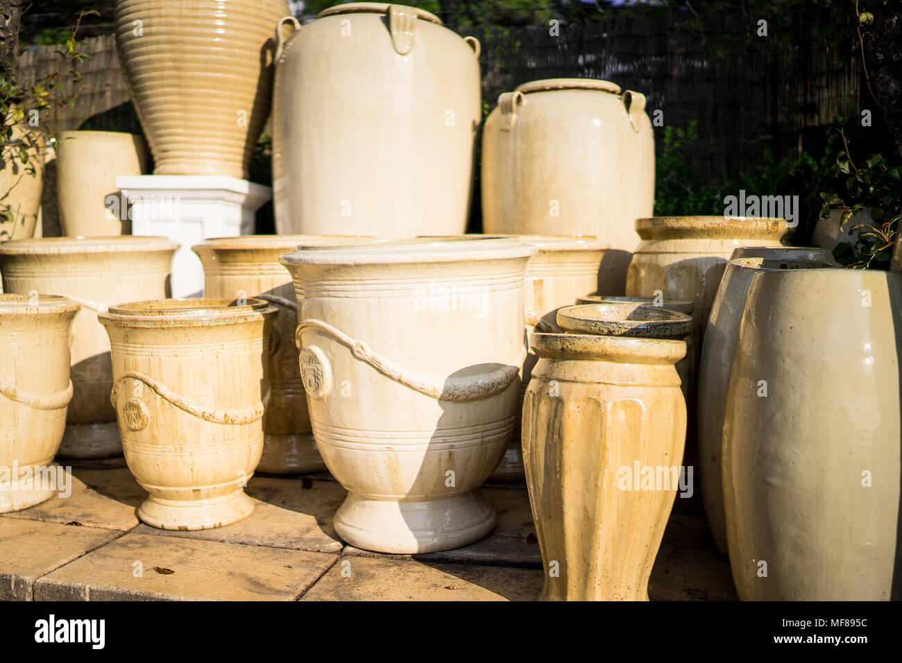 Cream coloured flower pots at a plant nursery Stock Photo - Alamy
