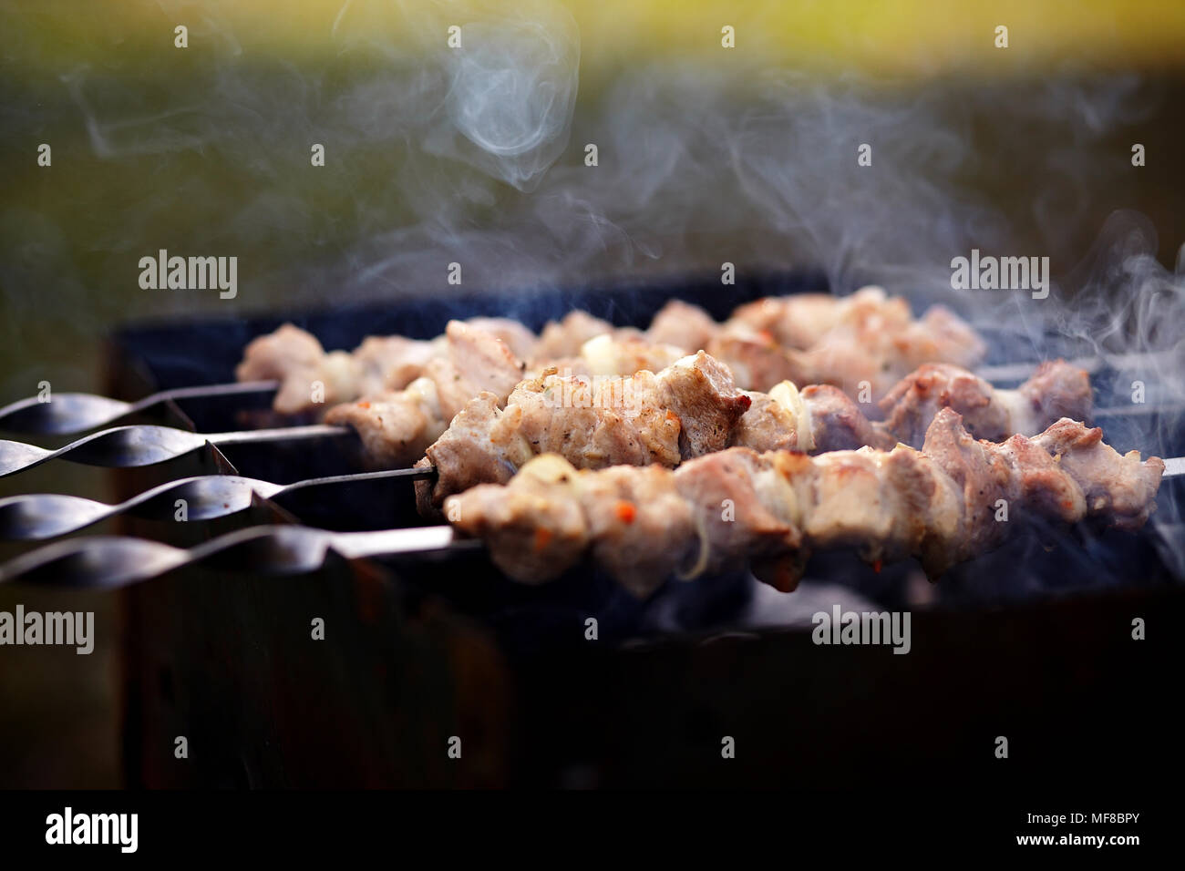 Fried meat. Shashlik preparation. Smoking shashlik. Tasty food Stock ...