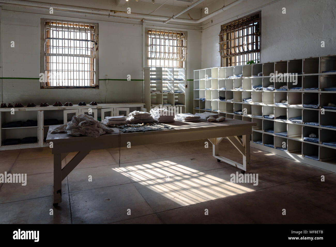 A table with sheets with barred windows at Alcatraz Stock Photo - Alamy