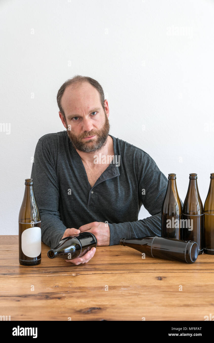 Sad male empty bottles hi-res stock photography and images - Alamy