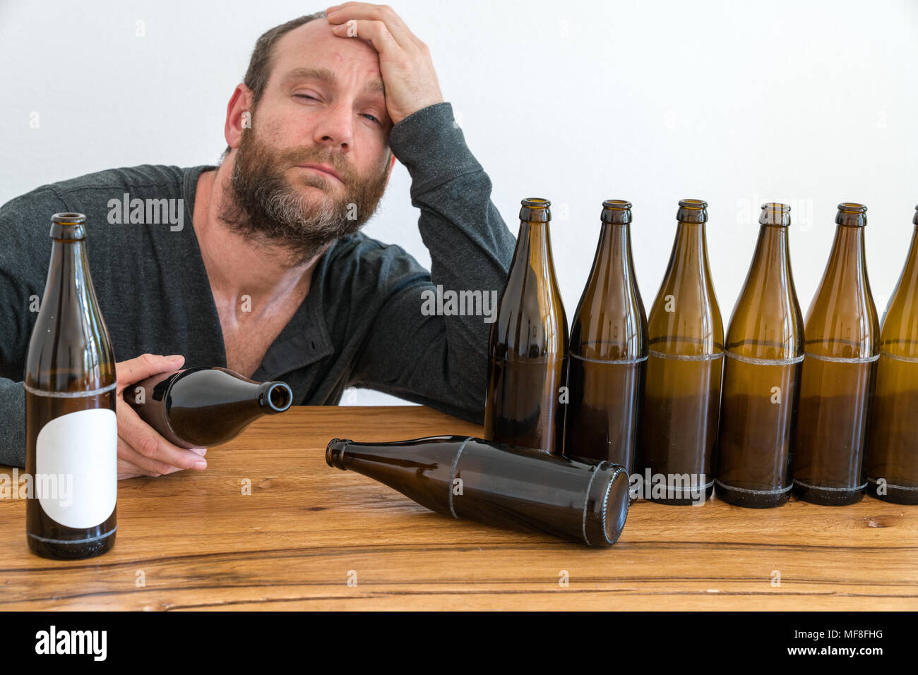 Sad male empty bottles hi-res stock photography and images - Alamy