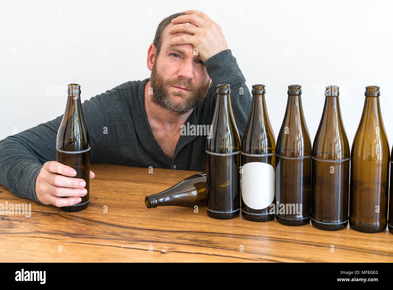 Sad male empty bottles hi-res stock photography and images - Alamy