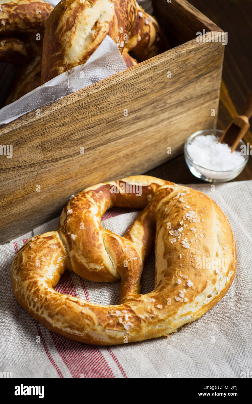 Pretzel with Sea Salt on Rustic Wooden Background Stock Photo - Alamy