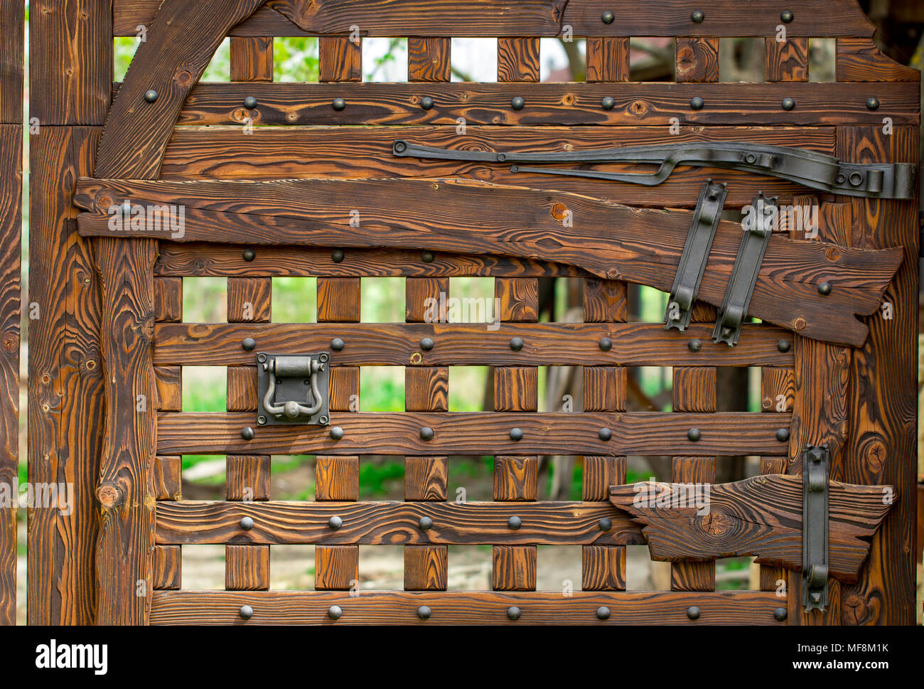 wooden gate with wrought iron elements close up Stock Photo - Alamy