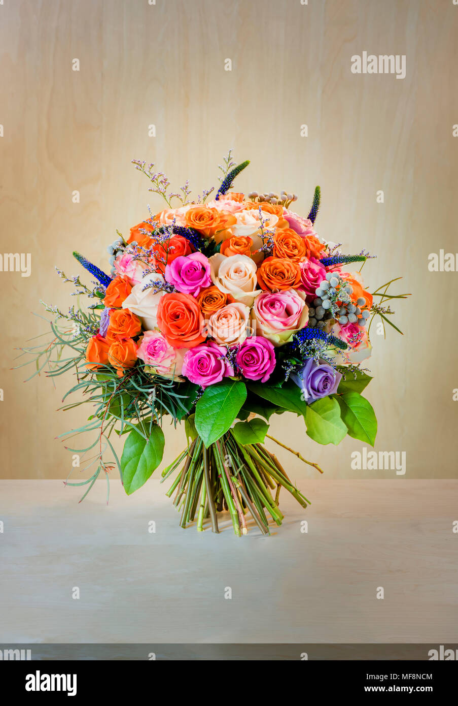 beautiful bouquet of flowers, multi-colored roses with green leaves ...
