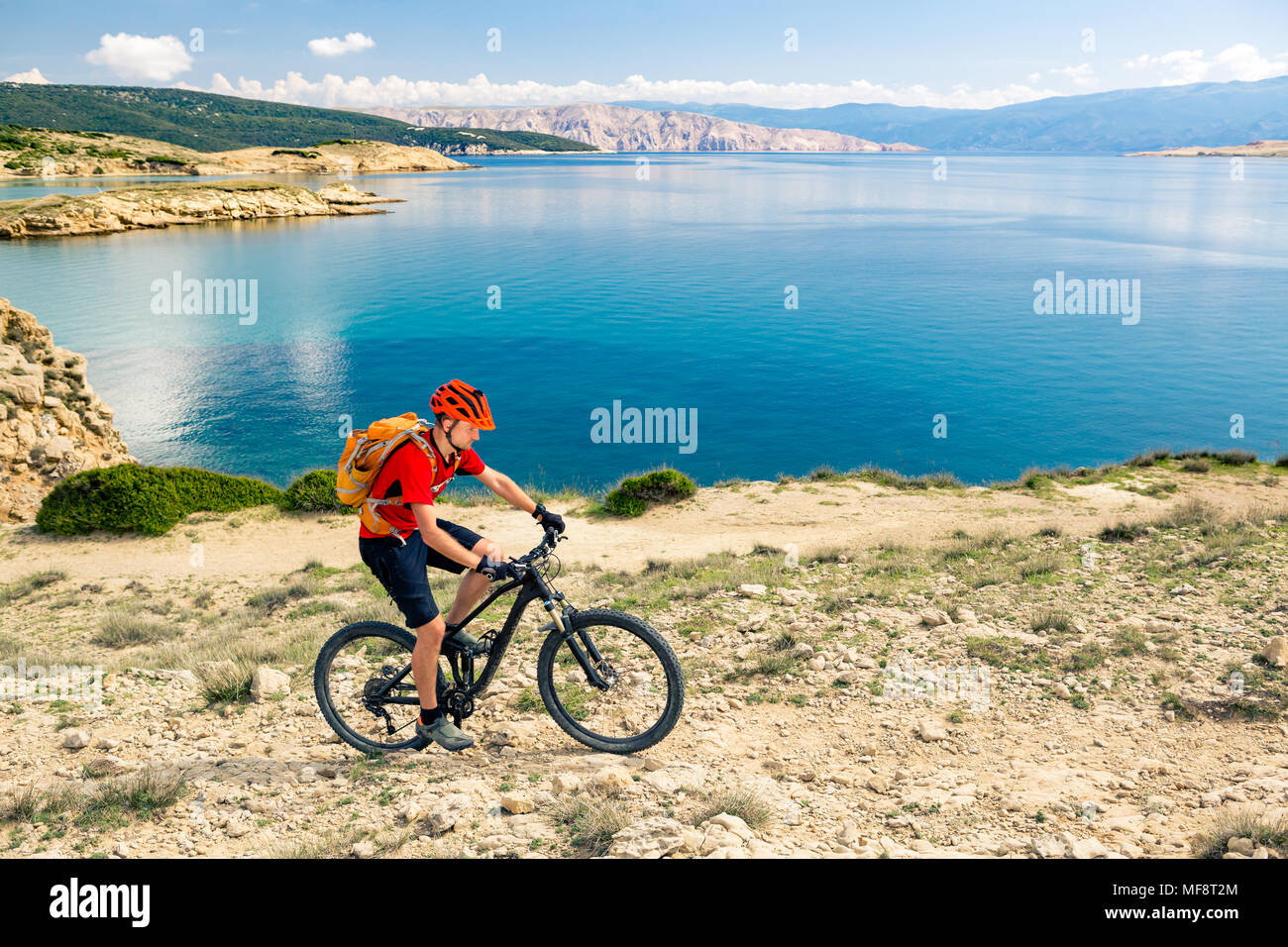 Mountain biker riding on bike in autumn inspirational mountains ...