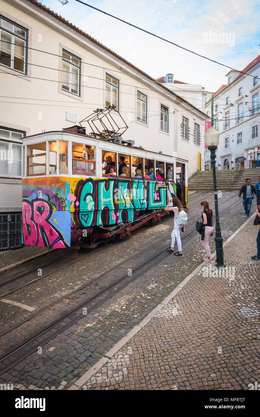 Lisbon tram, view of a colorful graffitied tram car on the Elevador do ...