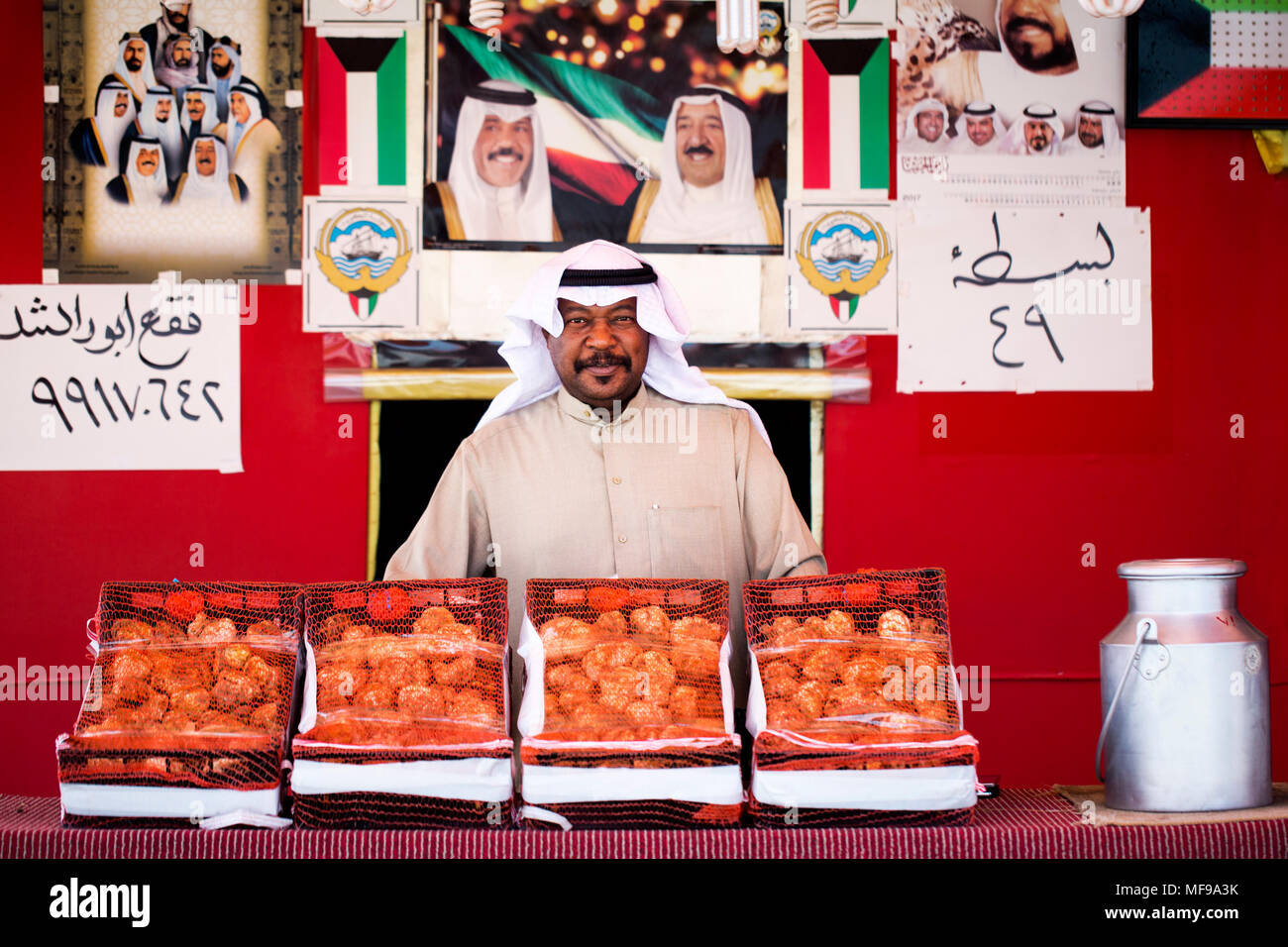 Fagga (desert truffles) sellers at a traveller's market in Kuwait Stock ...
