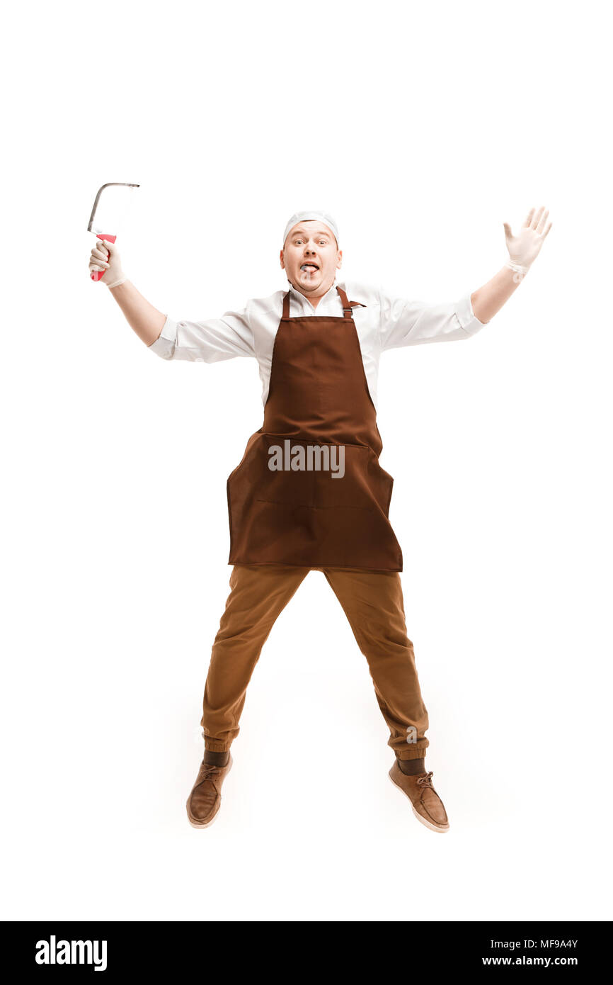 Smiling butcher posing with a cleaver isolated on white background ...