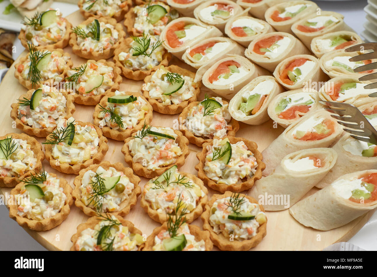 Catering food table of various appetizers, snacks and canapes Stock ...