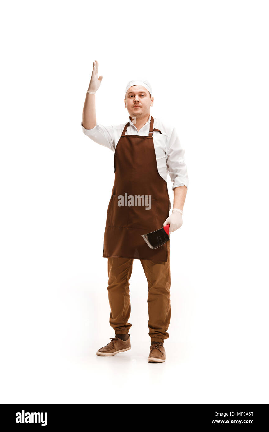 Smiling butcher posing with a cleaver isolated on white background ...