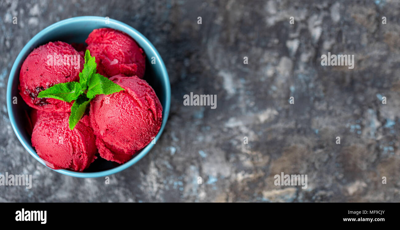 Raspberry ice cream in bowl on stone table Stock Photo - Alamy