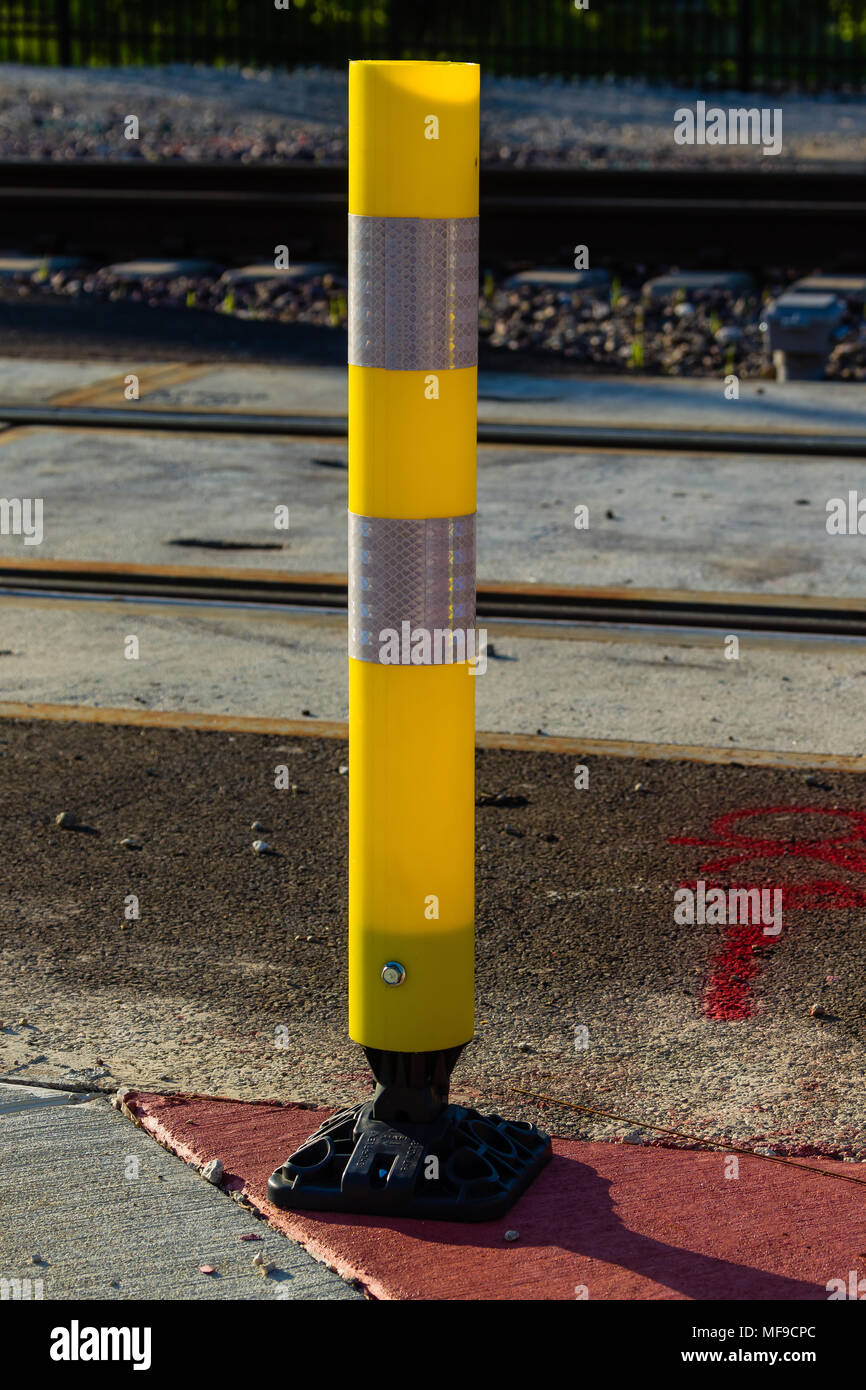 yellow tube roadside protection device glowing in the sun Stock Photo ...
