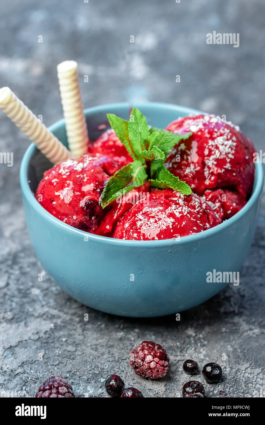 Raspberry ice cream in bowl on stone table Stock Photo - Alamy