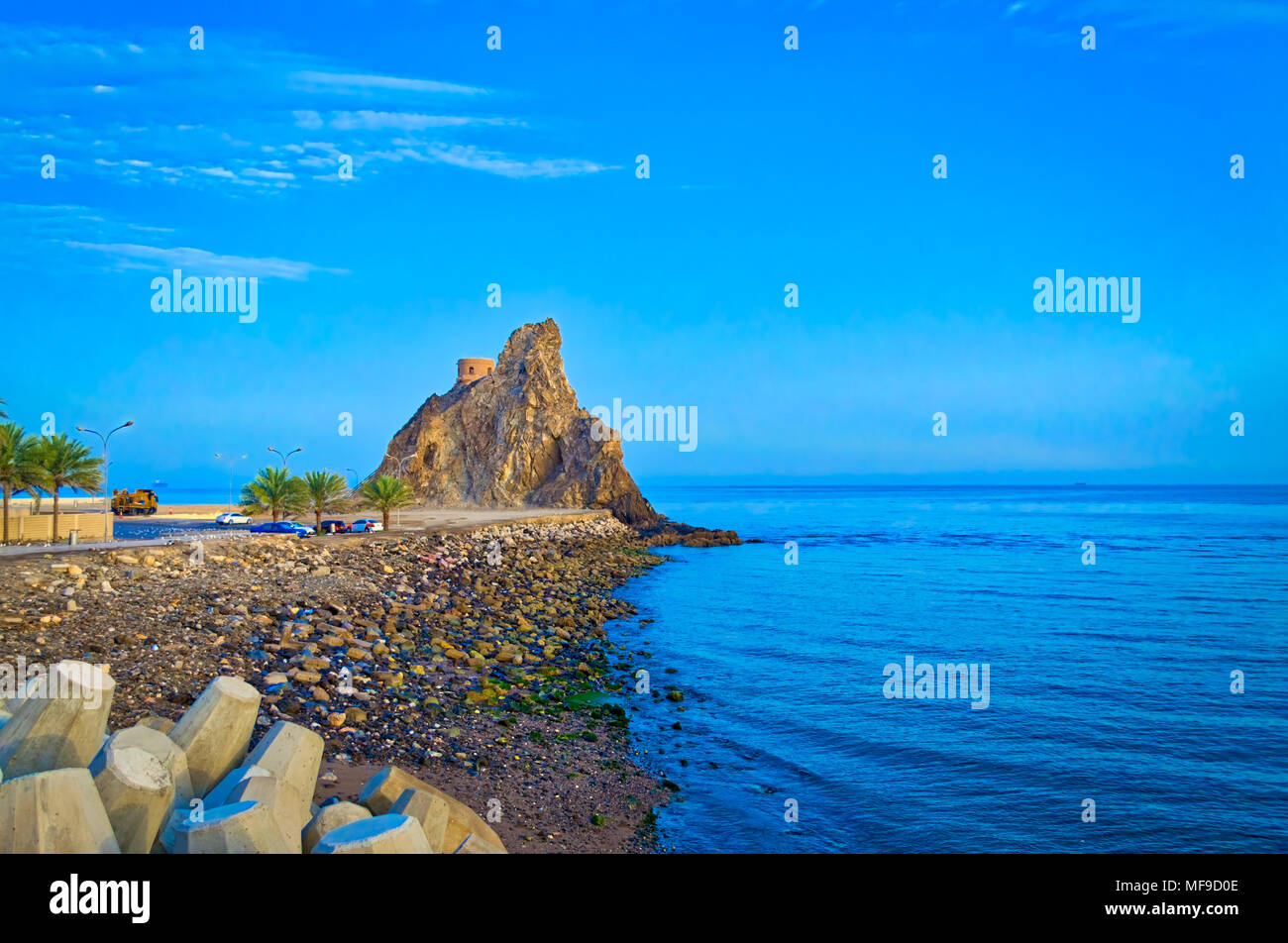 Old, abandoned military watchtower on an isolated hill on the seashore ...