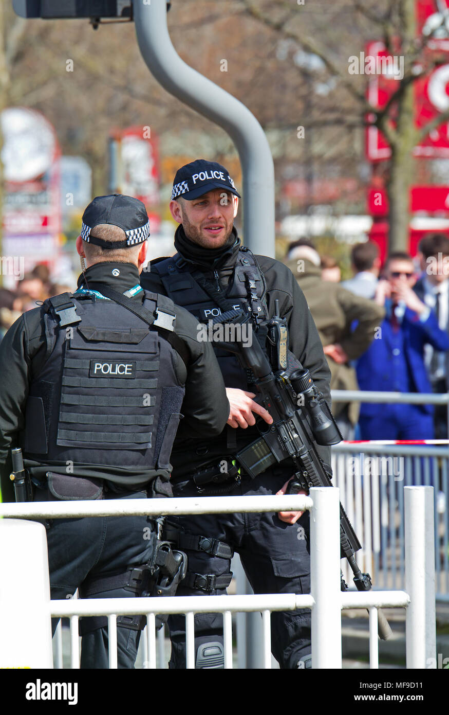 Heavily armed UK police officers on duty at the Aintree Grand National ...