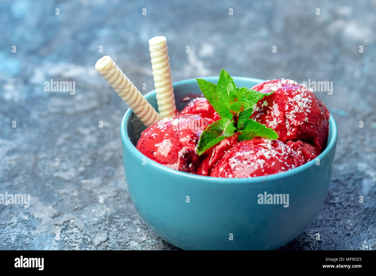 Raspberry ice cream in bowl on stone table Stock Photo - Alamy