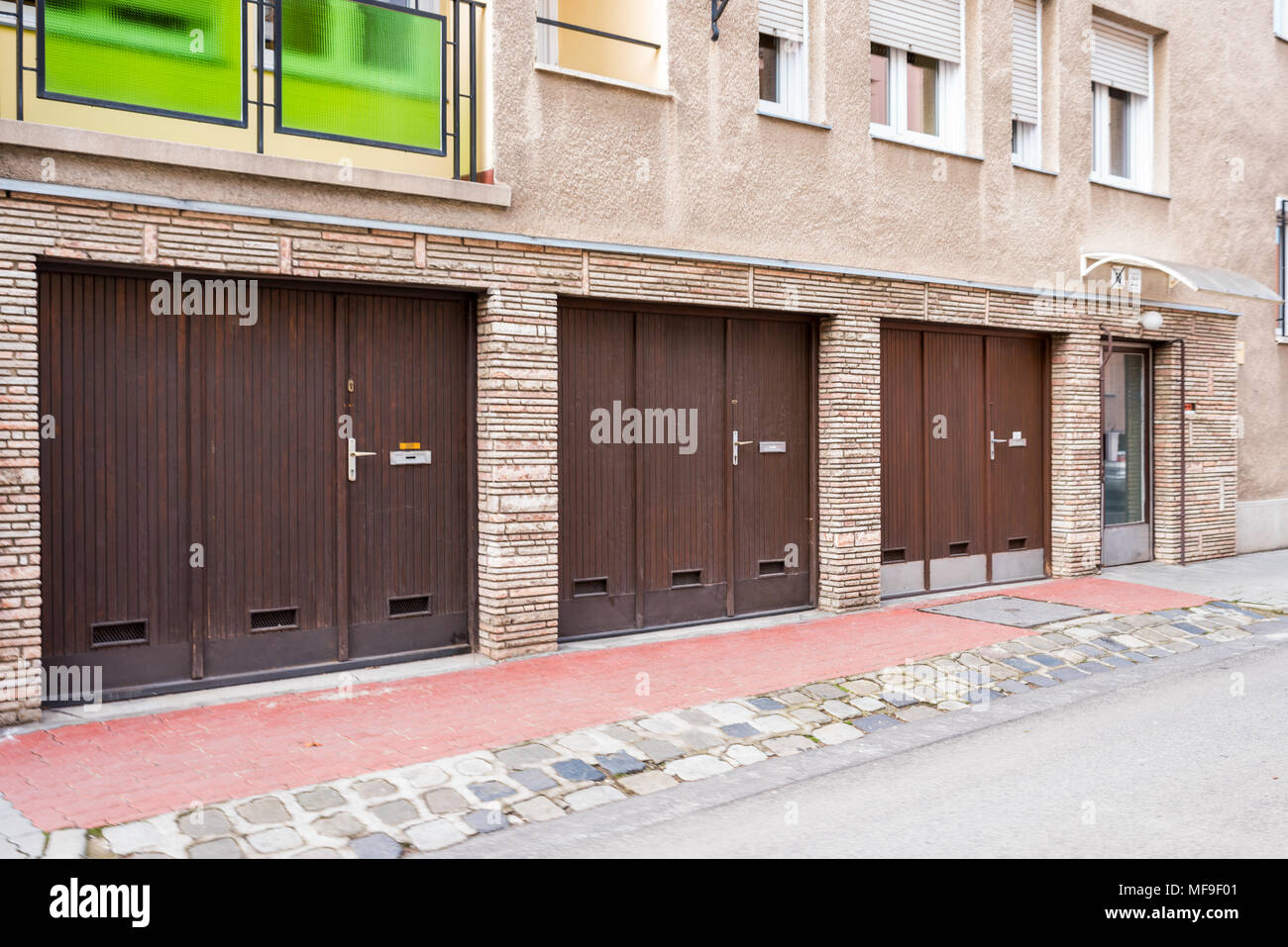 garage gates for cars in a building Stock Photo - Alamy