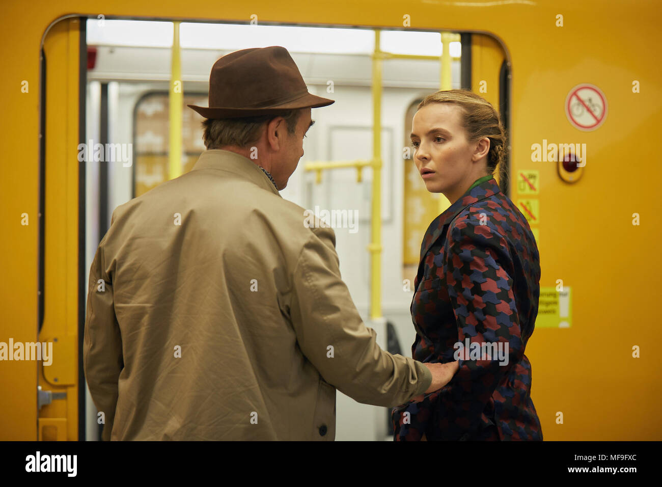 KILLING EVE, from left: David Haig (back to camera), Jodie Comer ...