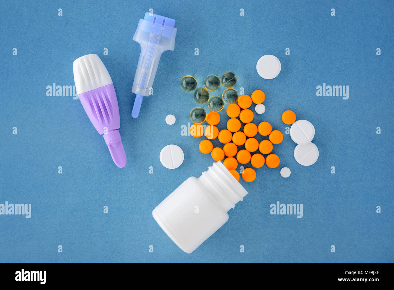 a composition of tablets of different kinds and lancets, adults and ...