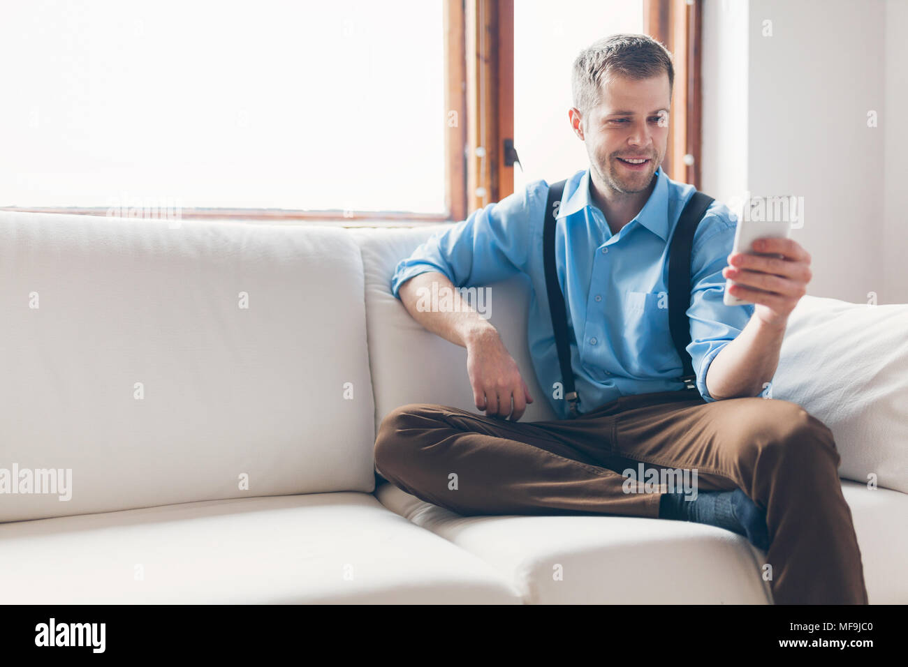 Smart handsome guy typing message hi-res stock photography and images ...