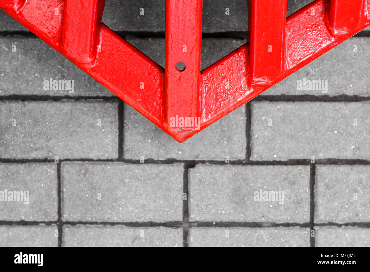 red arrow on the road. Red pointer, iron construction in the form of a ...