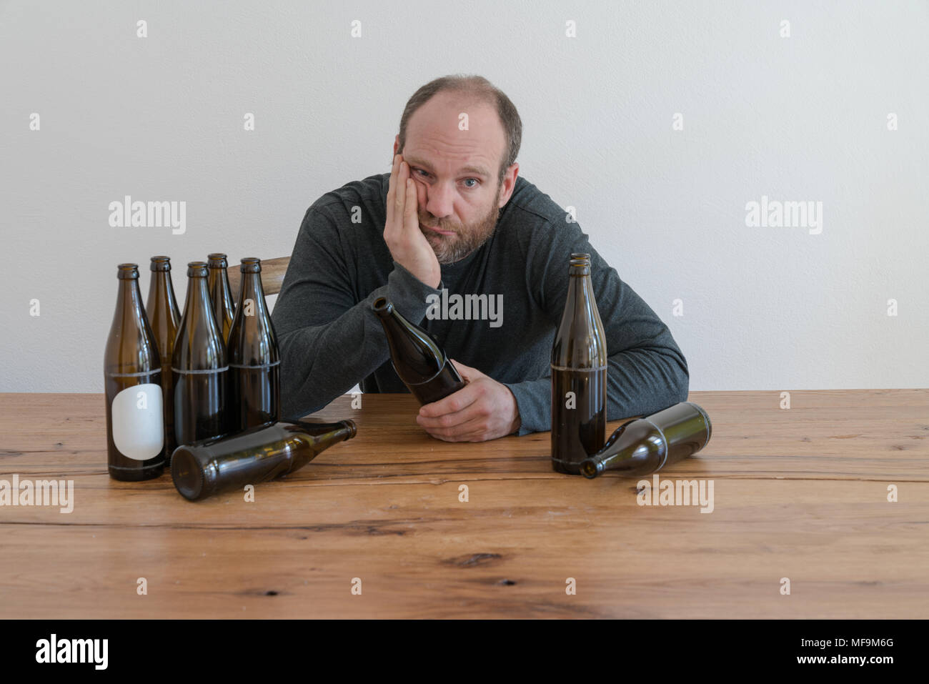 alcoholic and empty beer bottles Stock Photo - Alamy