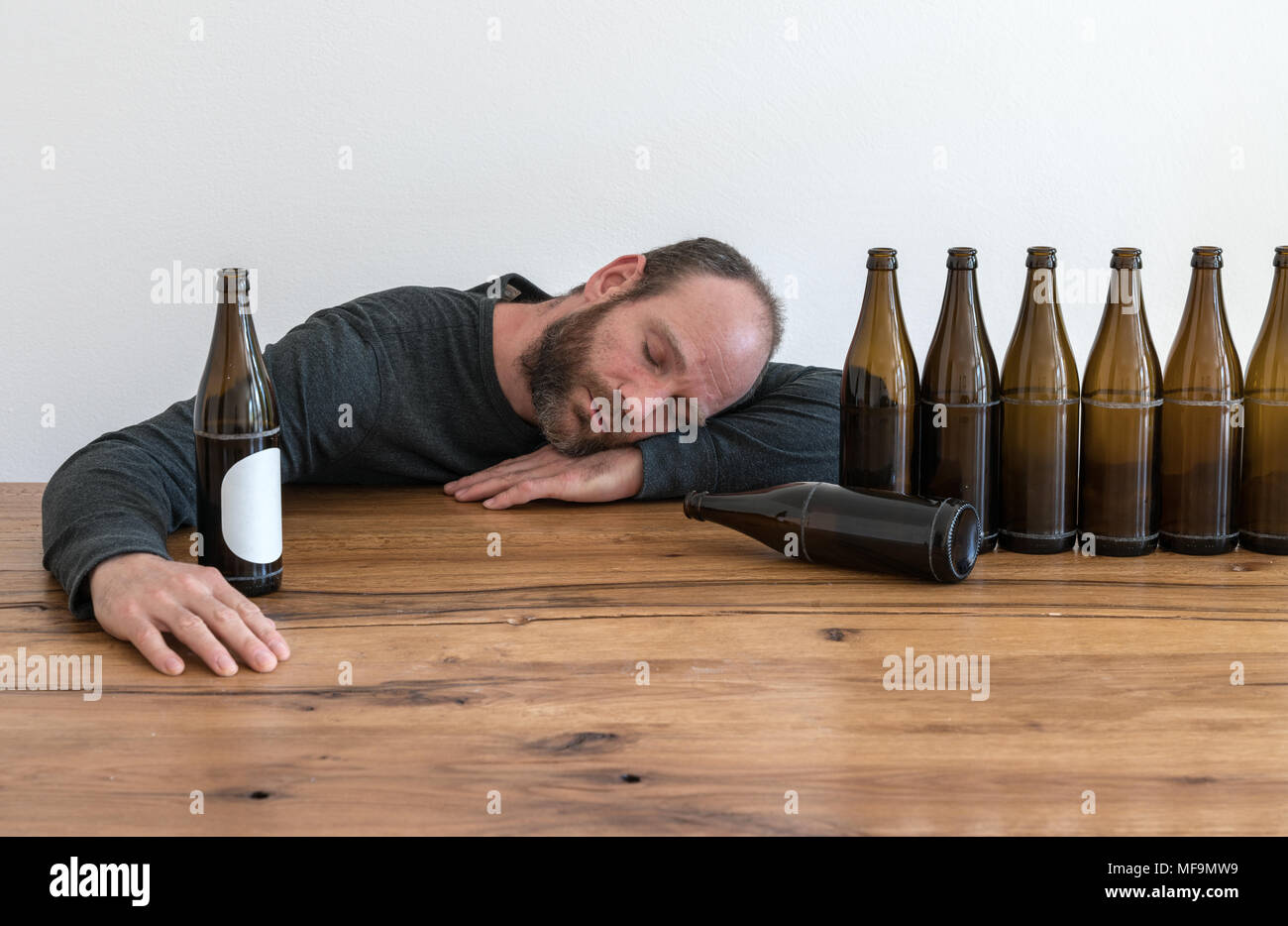 alcoholic and empty beer bottles Stock Photo - Alamy