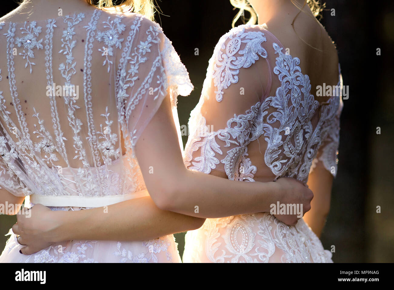Bride hugging two flower girls hi-res stock photography and images - Alamy