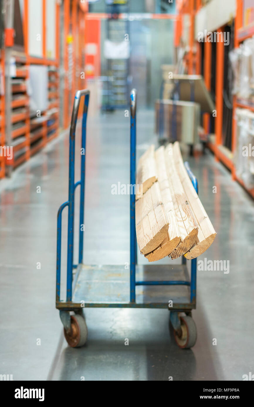 construction cart in the building store. Carts loaded with boards Stock ...