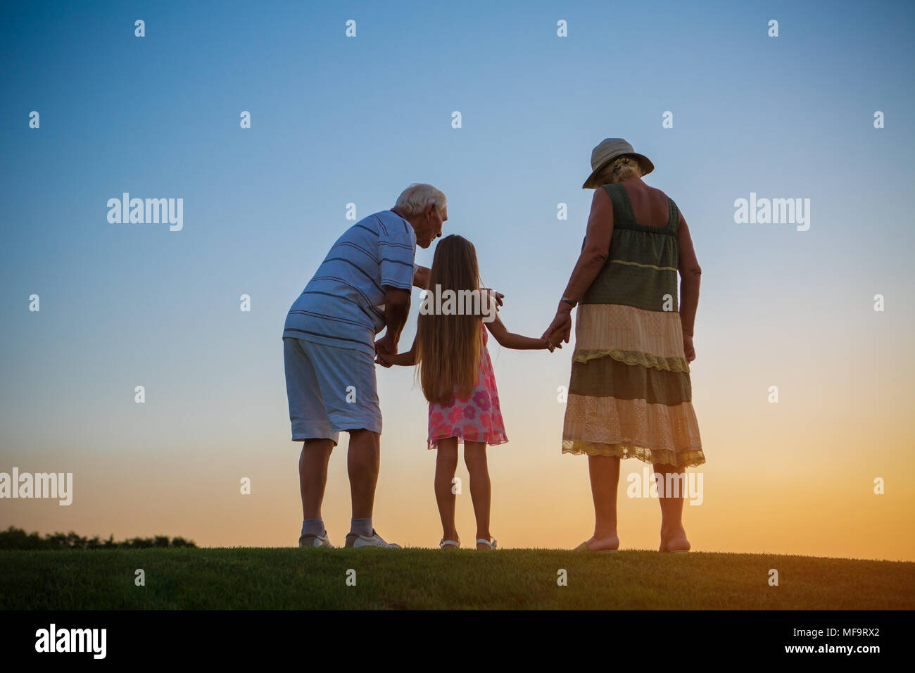 Family outdoors sunset grandparents hi-res stock photography and images ...
