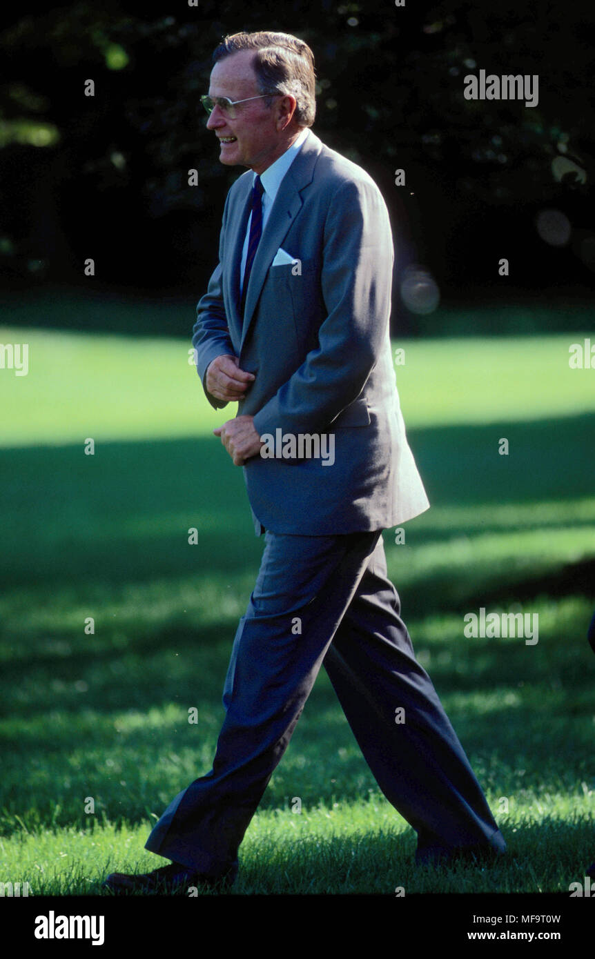 President George H.W. Bush walks from the Oval Office onto the South ...