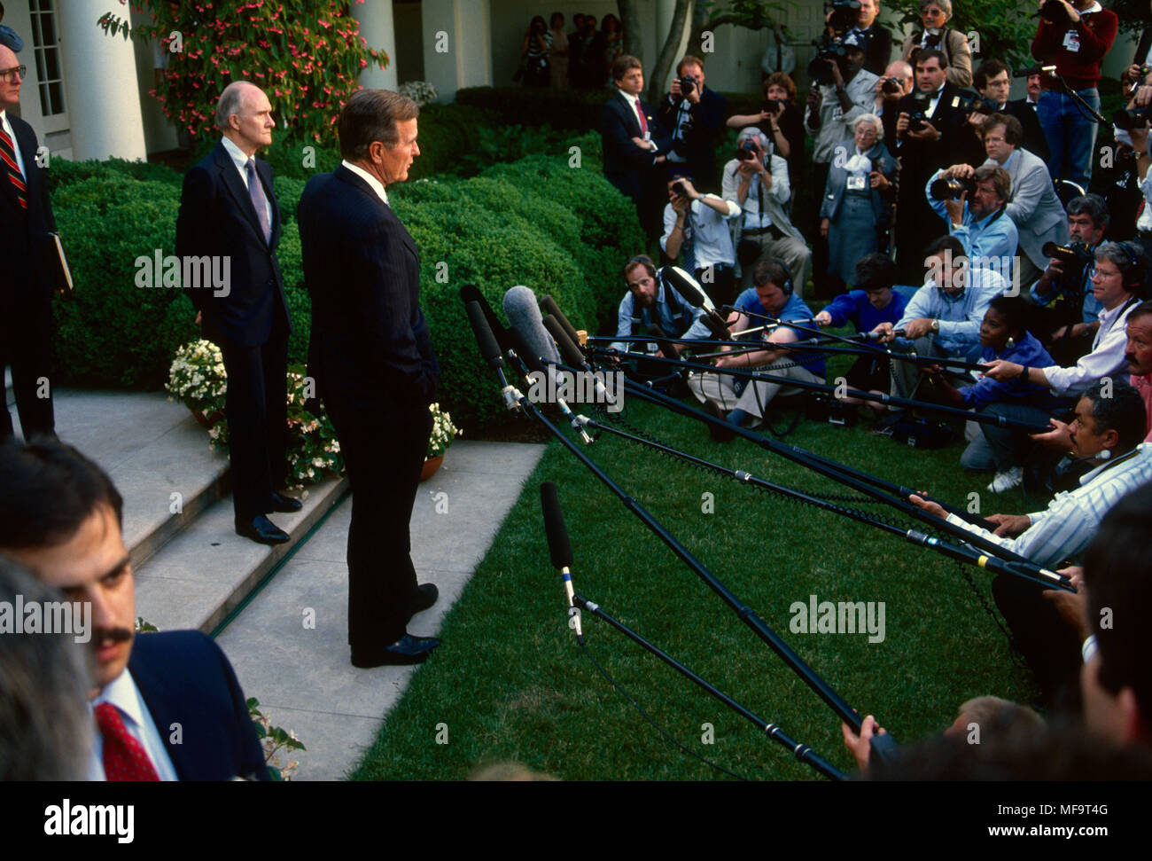 President George H.W. Bush has an exchange with reporters in the Rose ...