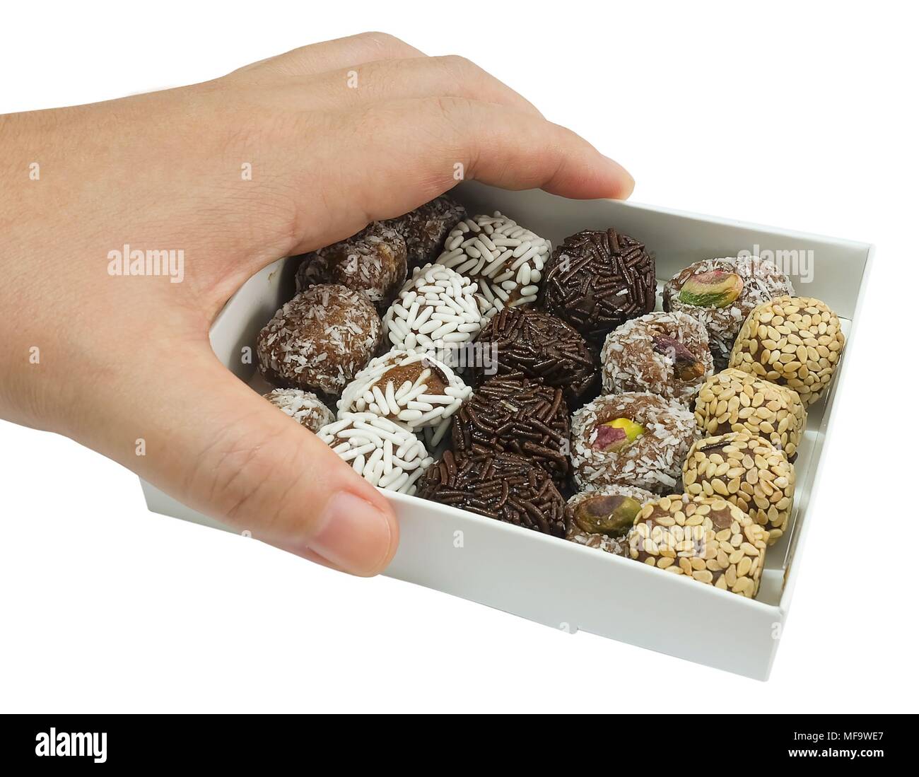 Sweet Food, Hand Holding Assorted Round Chocolate Candy Balls or ...
